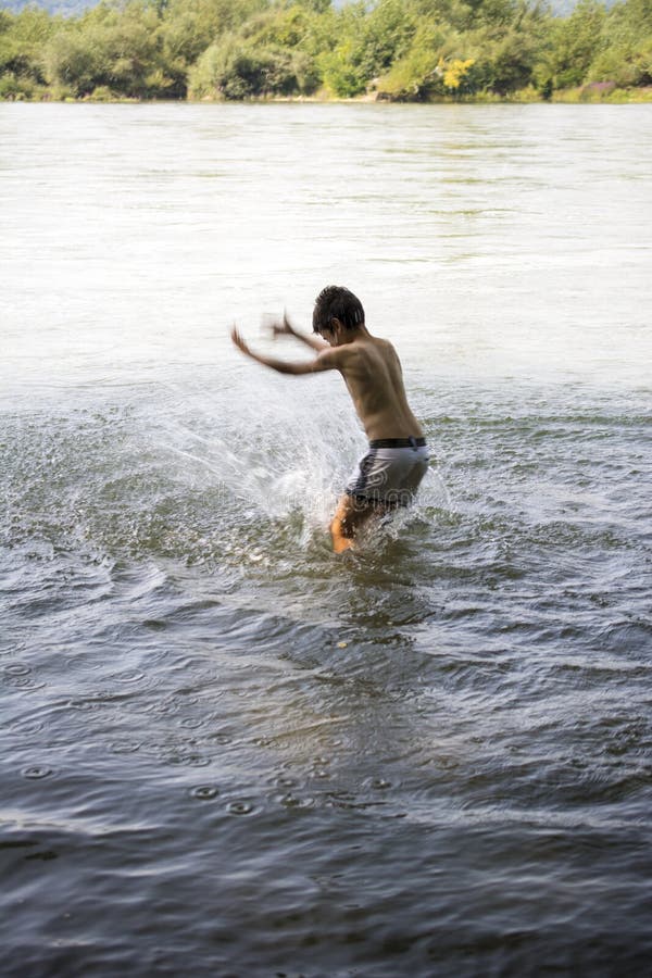 Boy and a river stock image. Image of fresh, summer, cool - 64757007
