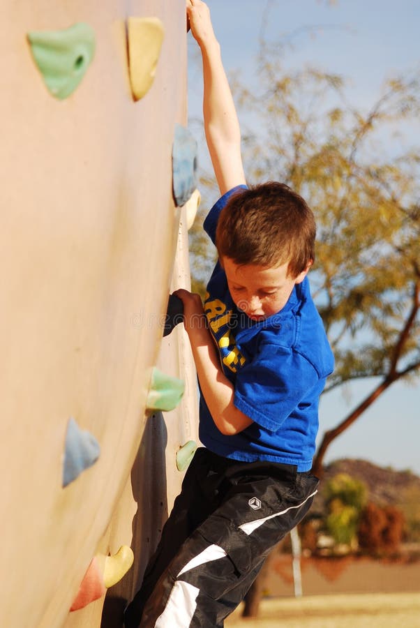 Boy rock climbing stock image. Image of activity, learn - 4723371
