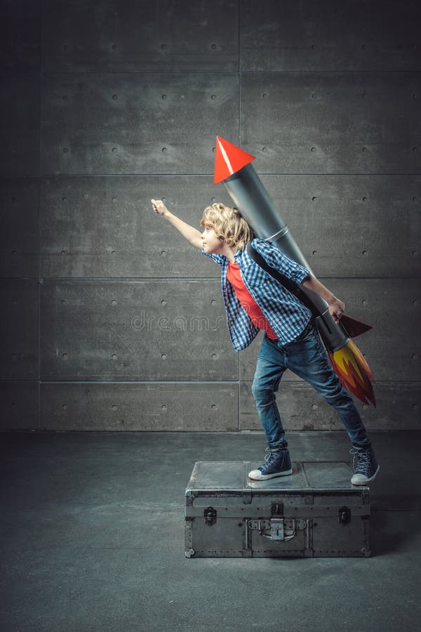 Boy with a rocket stock image. Image of playful, space - 72302975