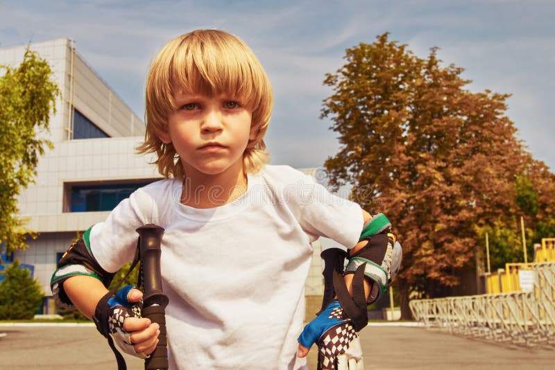 Boy rollerblading outdoors stock photo. Image of rollerskating - 98340754