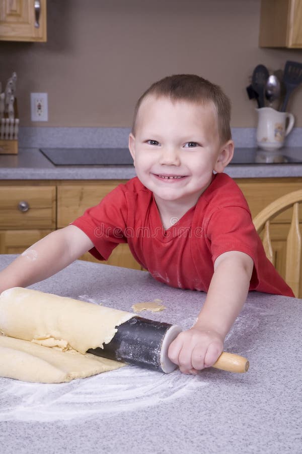 Boy rolling pin stock photo. Image of smile, dough, making - 11275124