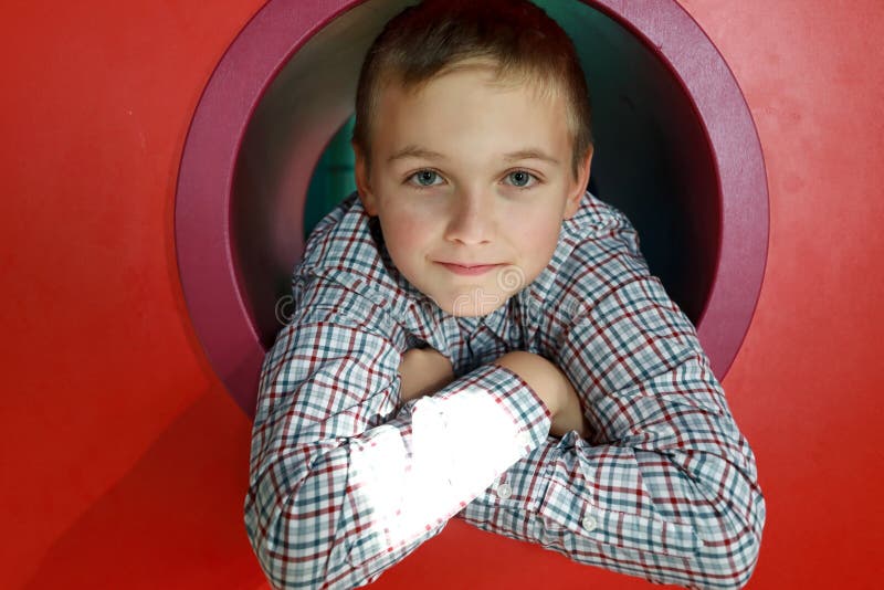 Boy in Round Hole in Playground Stock Image - Image of activity, game ...