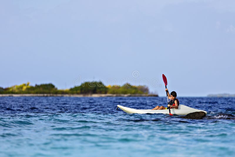 Boy rowing in sea kayak stock photo. Image of outdoor - 73034096