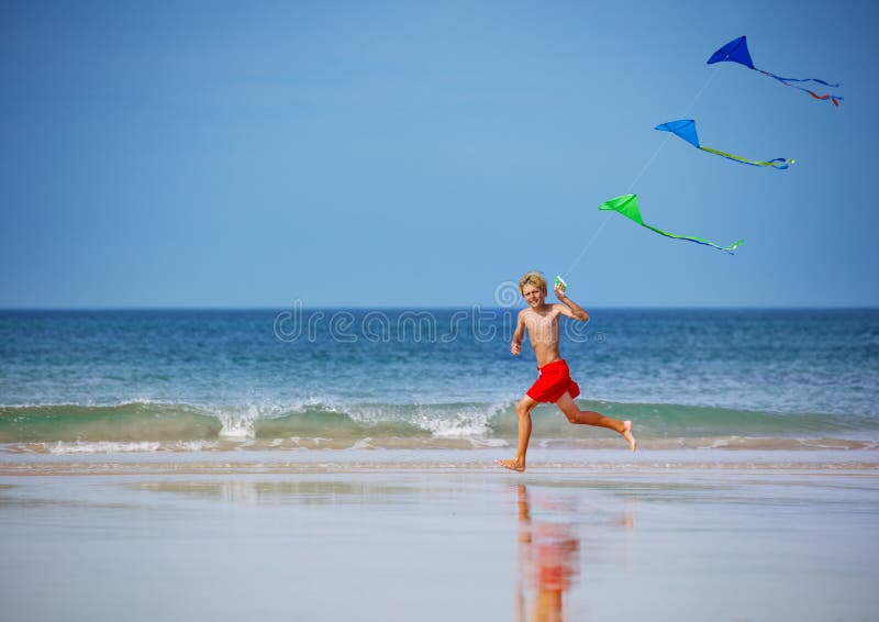 Boy Run Fast with a Kite Over the Sea Waves on Background Stock Photo ...