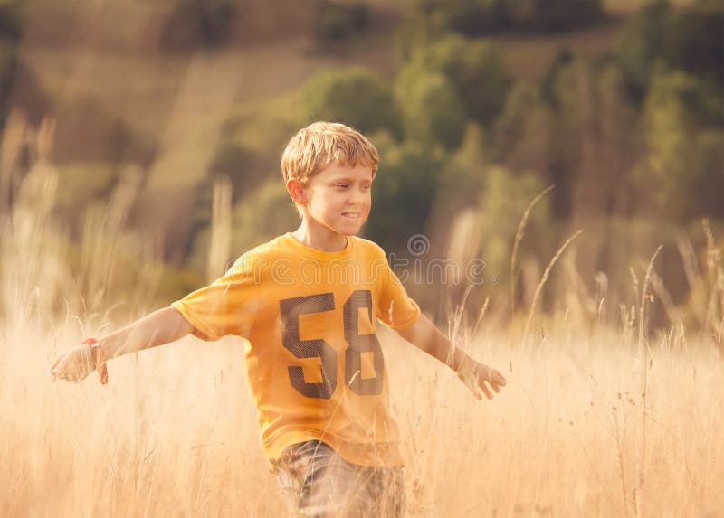 Boy run on sunny field stock image. Image of little, people - 59820223