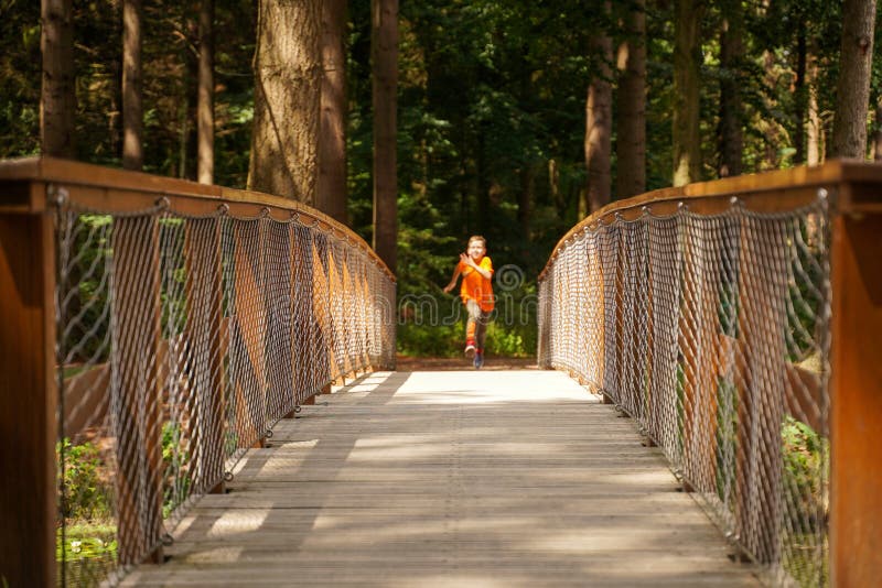 Boy Running Across the Bridge, Blurry Runner, Soft Focus. Stock Image ...