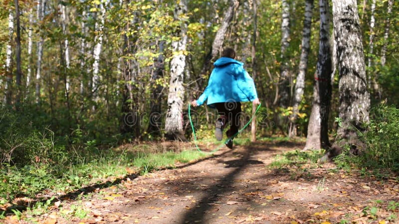 Boy is Running Away through the Forest Jumping Stock Video - Video of ...