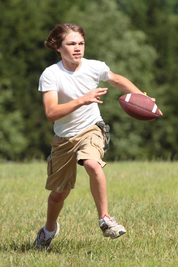 Boy Running with Football stock photo. Image of energy - 2750416