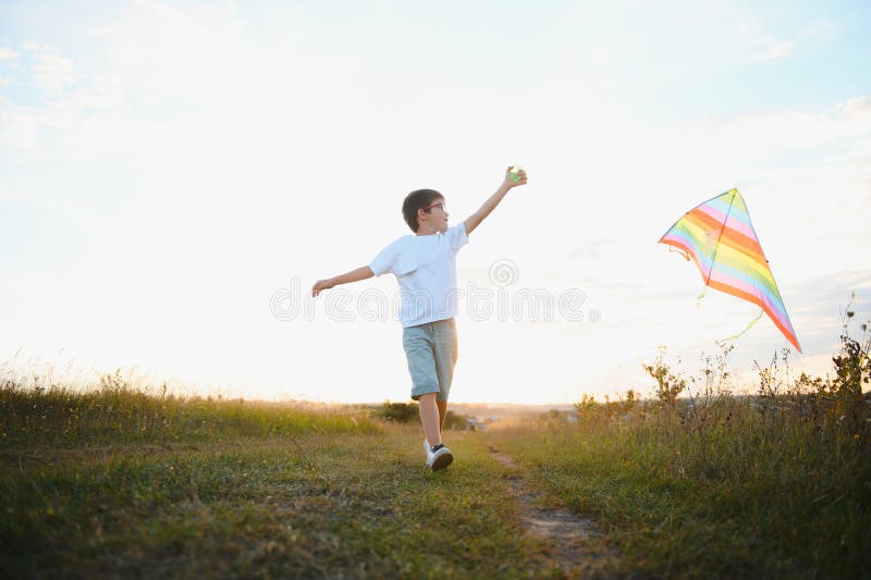 Boy is Running with a Kite during the Day in the Field Stock Image ...