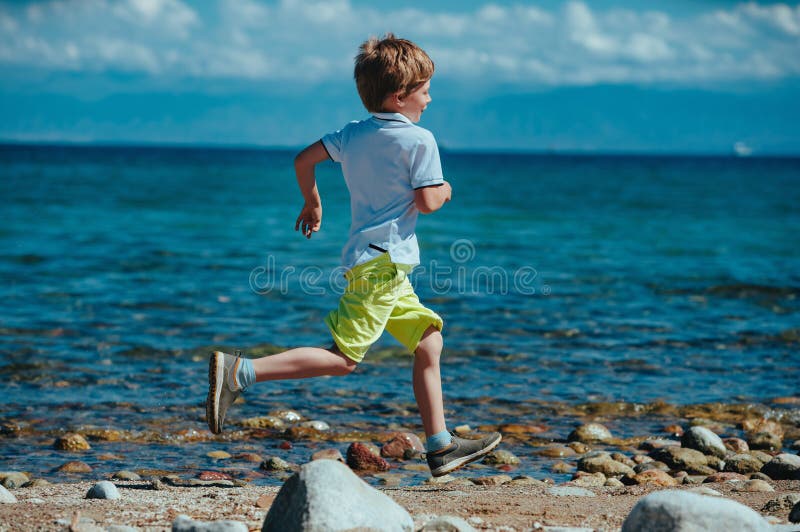 Boy Running on Lake Shore at Sunny Day Stock Image - Image of motion ...