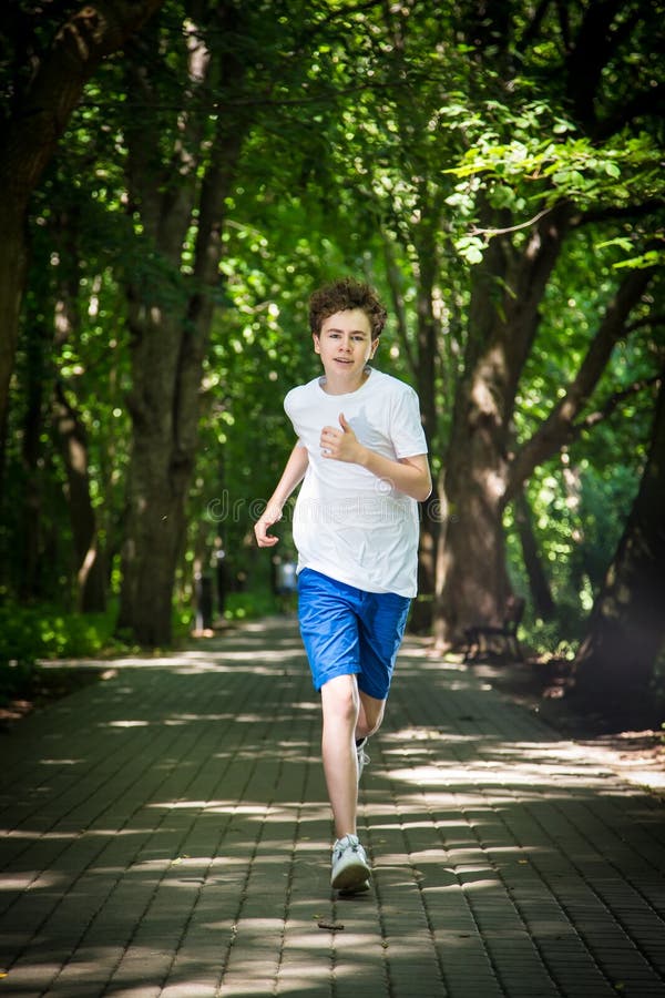 Boy running outdoor stock photo. Image of enjoying, lane - 74435030