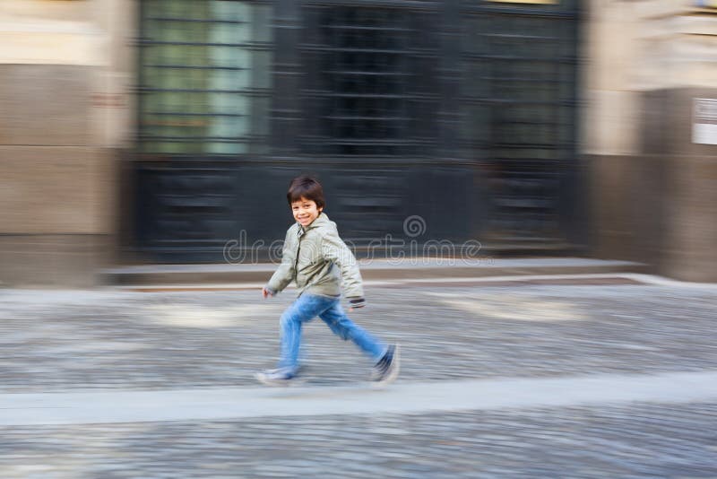 Boy running on street stock photo. Image of childhood - 31884168