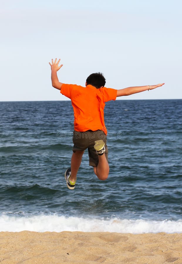 Boy running to the sea stock photo. Image of childhood - 40504636