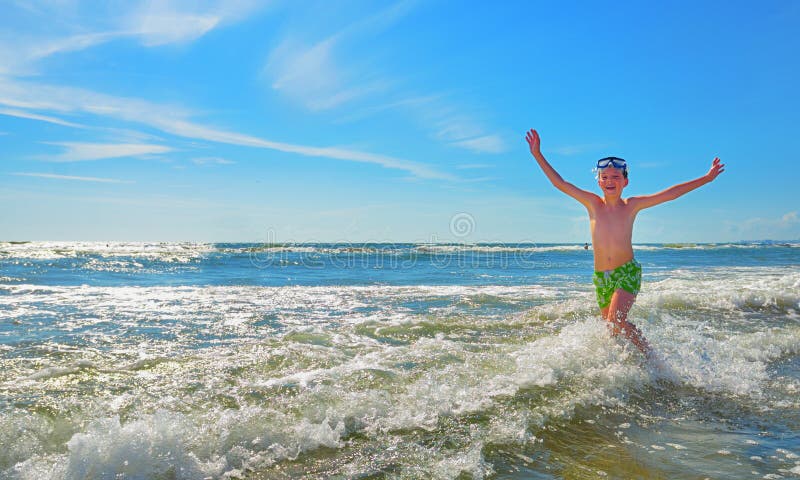 Boy Running through the Water Stock Image - Image of froth, power: 33179075