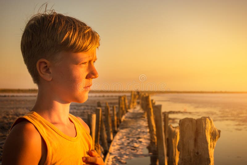 The Boy`s Face Lit by the Sun at Sunset Stock Image - Image of leisure ...