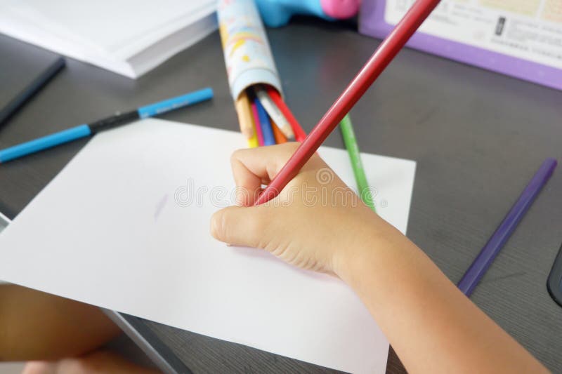 A Boy S Hand is Practicing Drawing Shapes on Paper Stock Image - Image ...