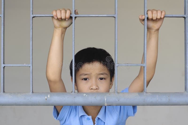 Sad Boy Behind Bars Stock Photos - Free & Royalty-Free Stock Photos ...