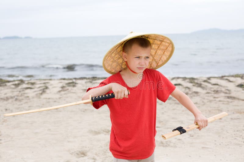 Boy with a samurai sword stock photo. Image of china - 25300762