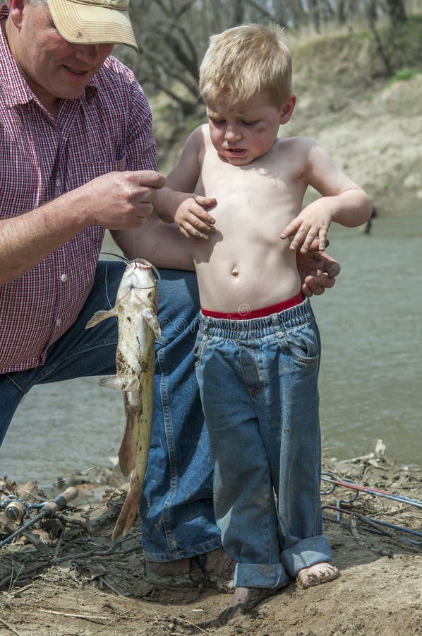 Child afraid of a fish stock photo. Image of line, upset - 39757422