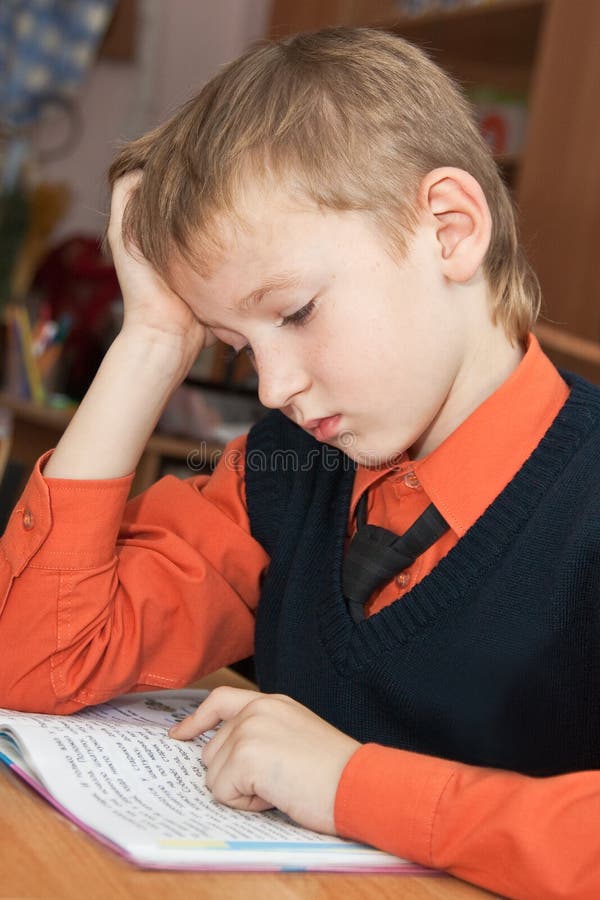 Boy at school at a lesson stock image. Image of children - 16459615