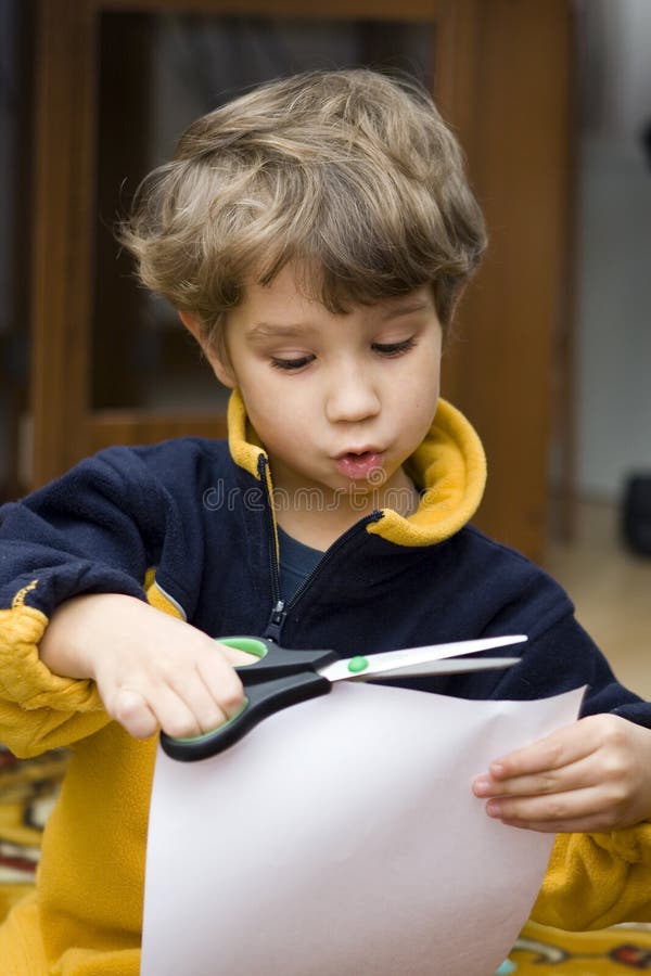 The boy and scissors stock image. Image of education, room - 8518499