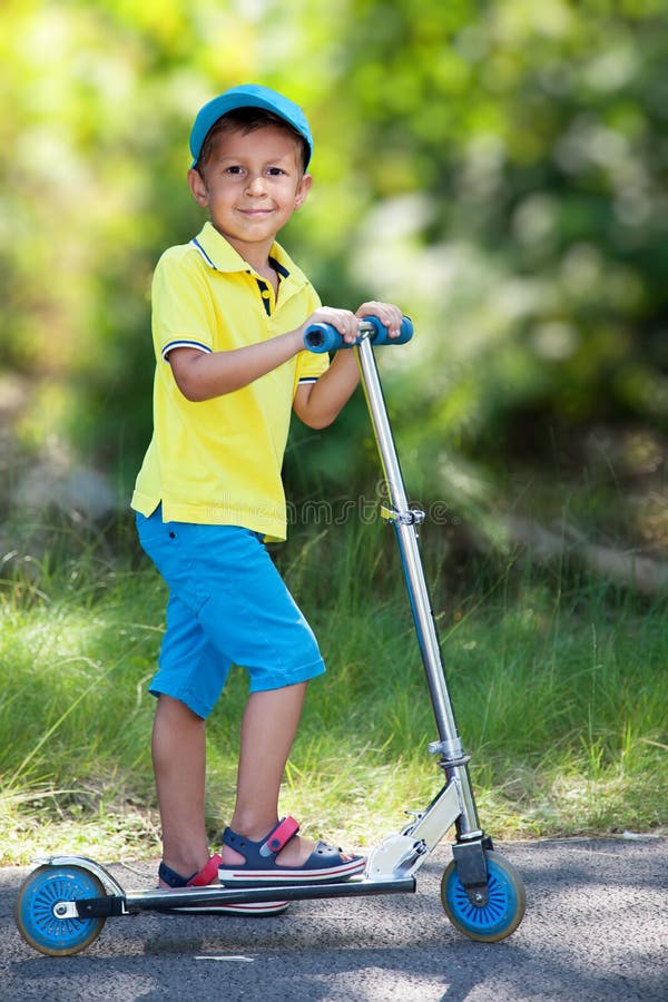 Boy with Scooter in the Park. Stock Photo - Image of young, summer ...
