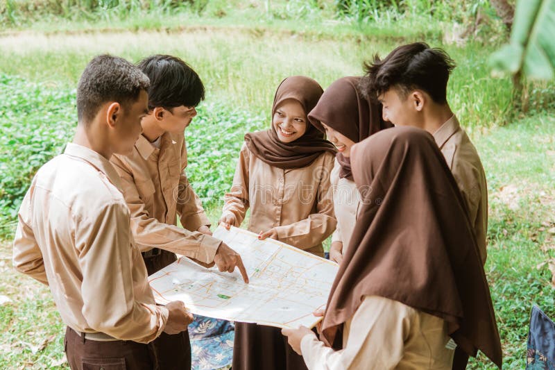 Boy Scout with Finger Pointing at Map with Group Mates Stock Image ...