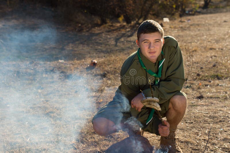 Boy Scout Making Fire on the Campground Stock Photo - Image of alight ...