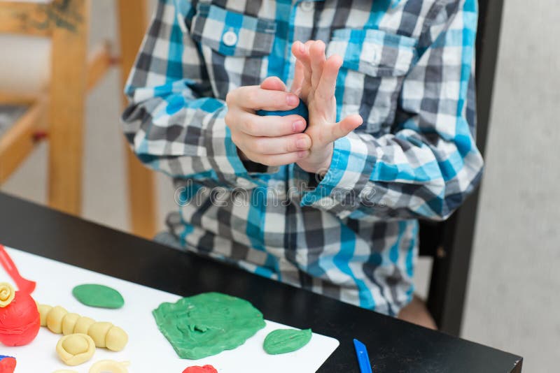 Boy Sculpts from Plasticine at Home Stock Image - Image of artistic ...