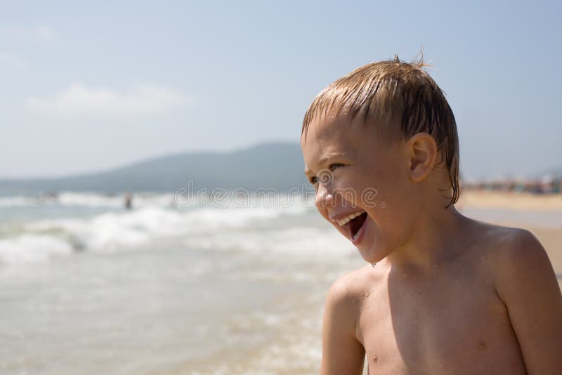Boy and sea stock image. Image of laugh, play, male, playful - 10611863