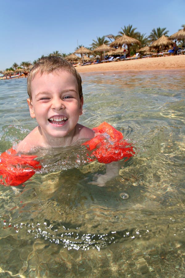 Boy in sea stock photo. Image of play, color, relaxation - 2513974