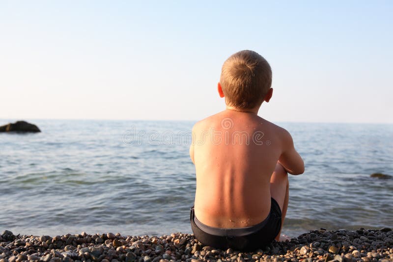 Boy and Sea stock image. Image of sunlight, calm, child - 25669311
