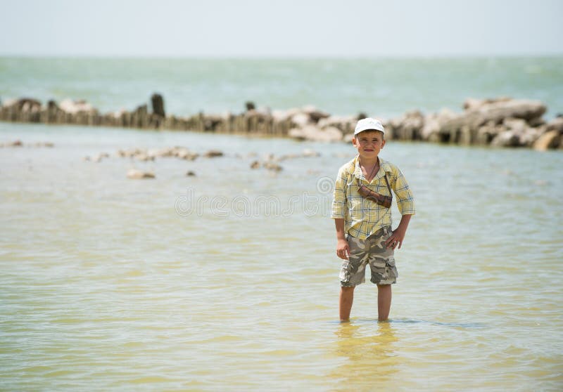 Boy on the sea stock photo. Image of distance, landscape - 71638010