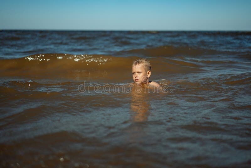 Boy in the Sea. Learning To Swim Stock Image - Image of outdoor ...