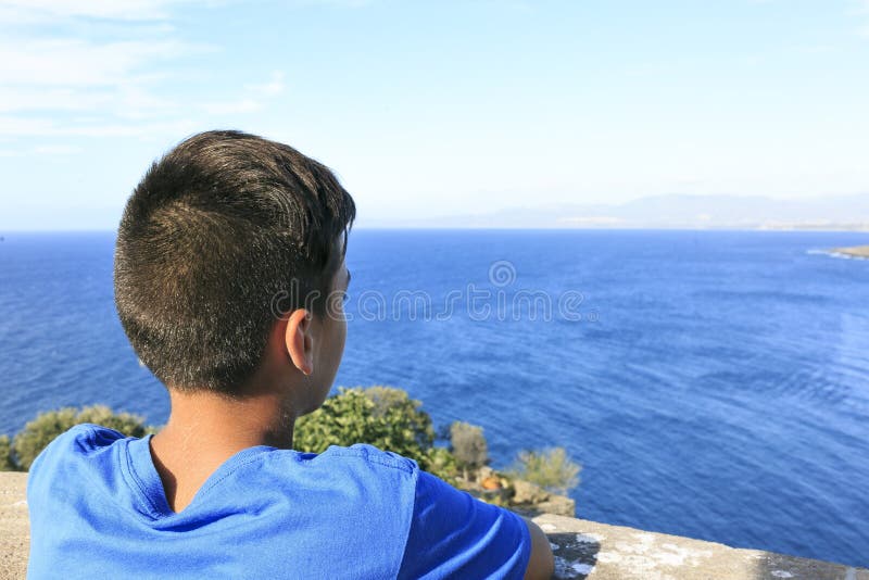 Boy seeing the blue sea stock image. Image of holiday - 97172865