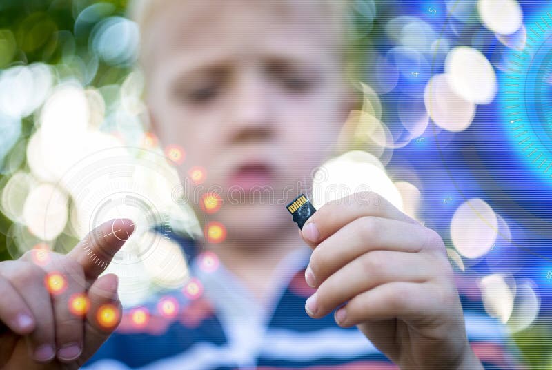The Boy Sees in Her Hands MicroSDHC Memory Chip. Focus on the Memory ...