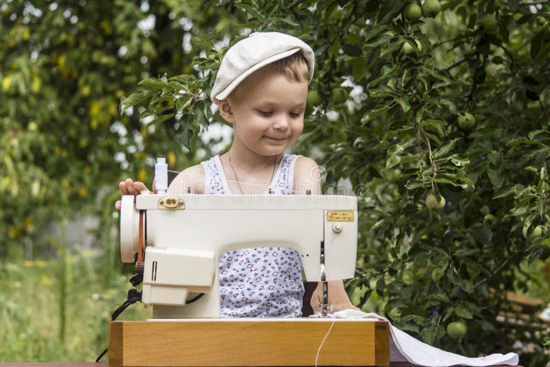 Boy Sews on the Sewing Machine Stock Image - Image of cloth, machine ...