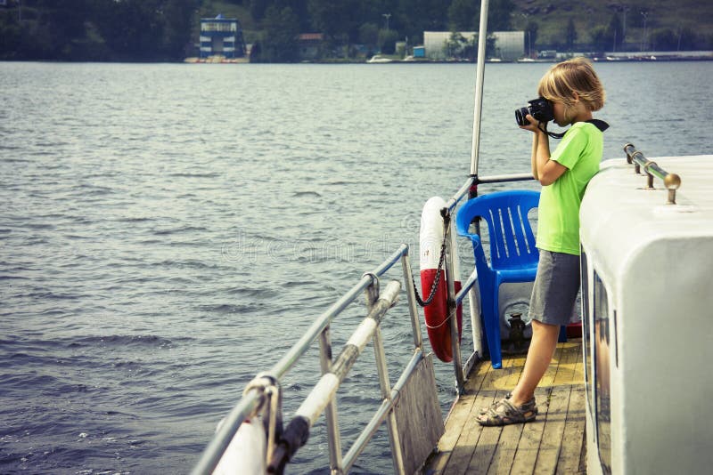 Boy on the Ship Photographing Water Stock Photo - Image of ocean ...