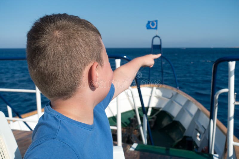 Boy on a ship sets sail stock photo. Image of beautiful - 217376690