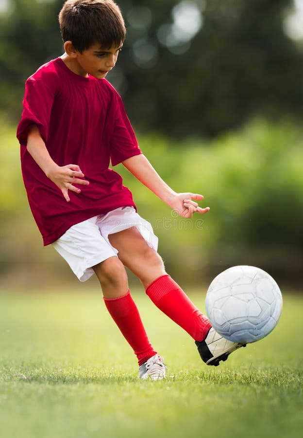 Boy Shooting at Goal stock photo. Image of action, kick - 265462834