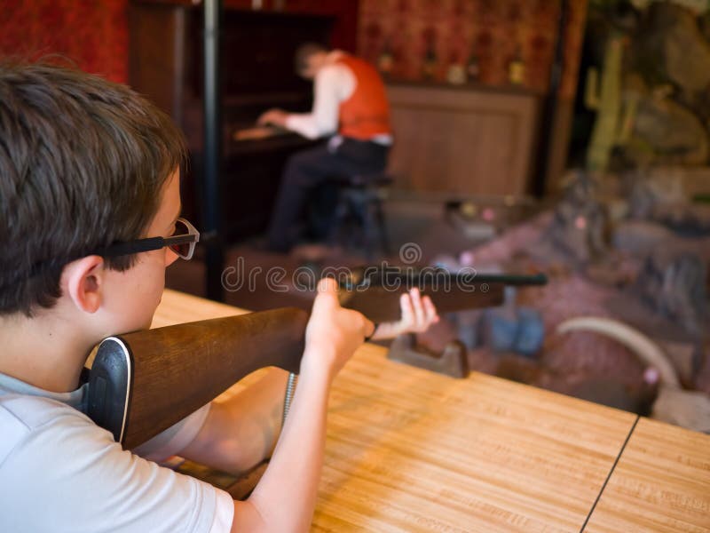 Boy Shooting Gun stock photo. Image of game, operated - 20807718