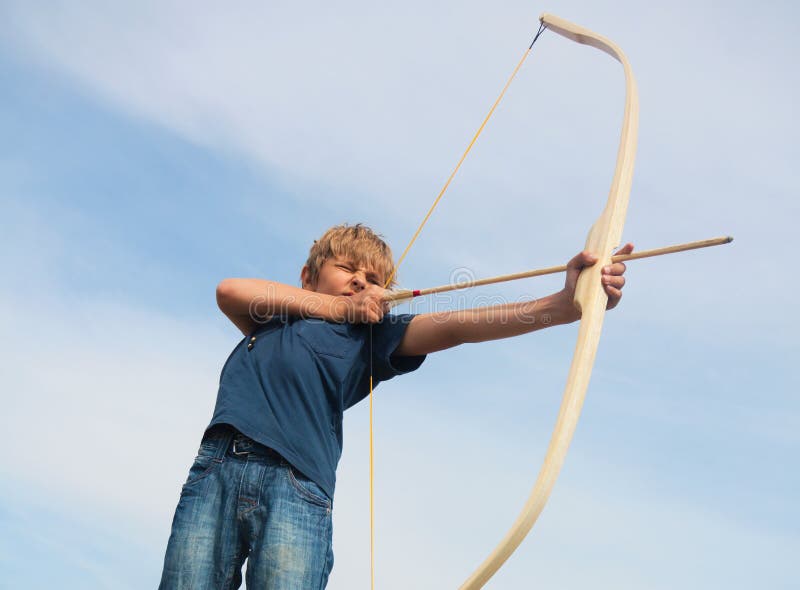 Boy Shoots a Bow at a Target Stock Image - Image of concentration ...