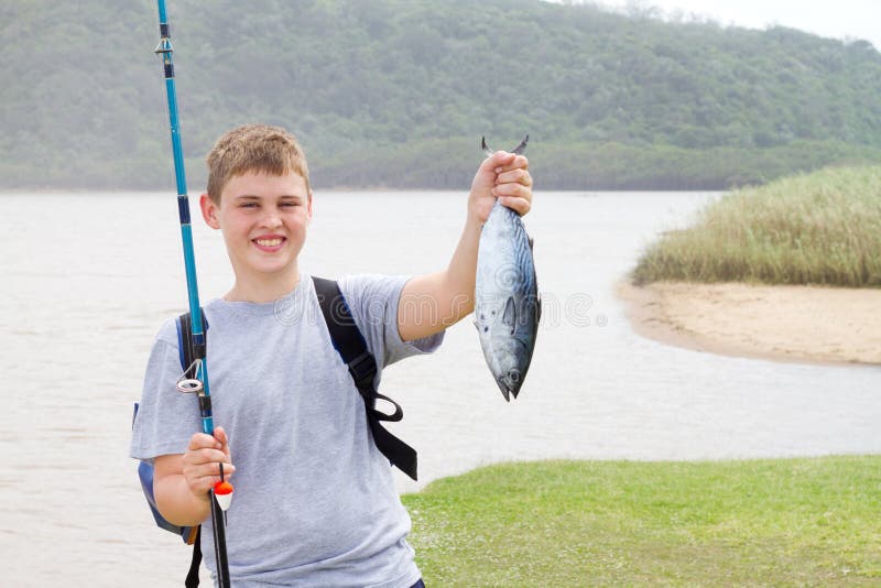 Boy showing a fish stock image. Image of preteen, carefree - 22168055