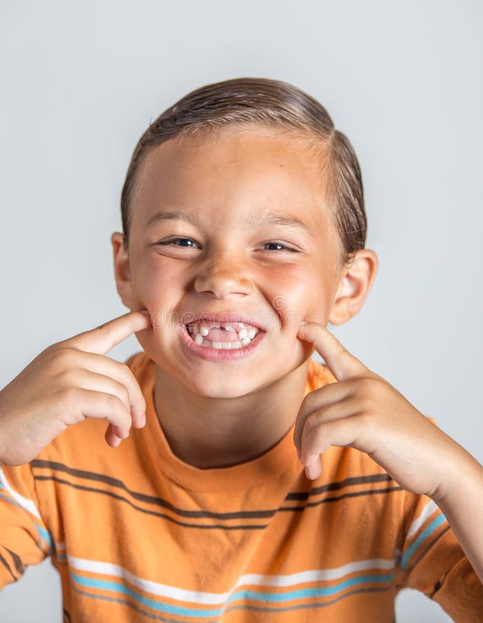 Boy showing missing teeth. stock photo. Image of dental - 56741550