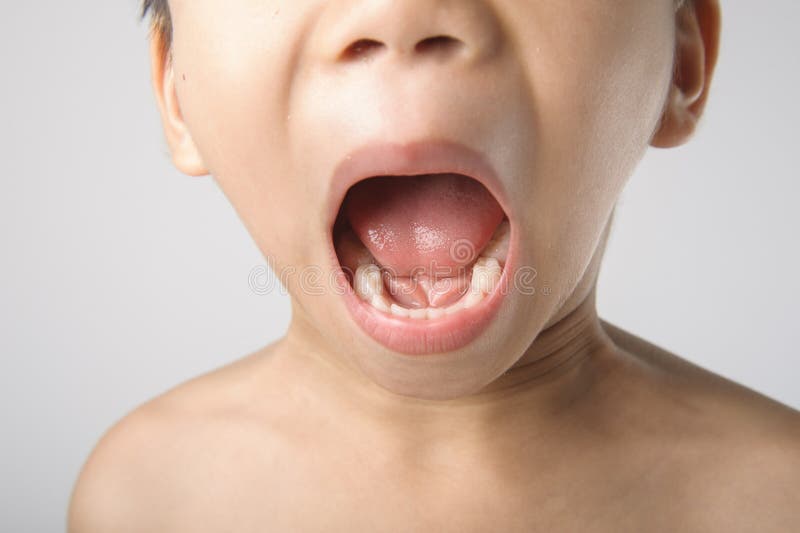 Boy showing teeth stock image. Image of teeth, grow, studio - 50183503