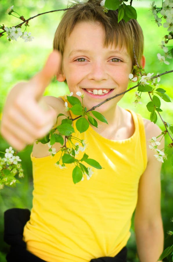 Boy showing thumbs up stock image. Image of happy, beautiful - 31408927