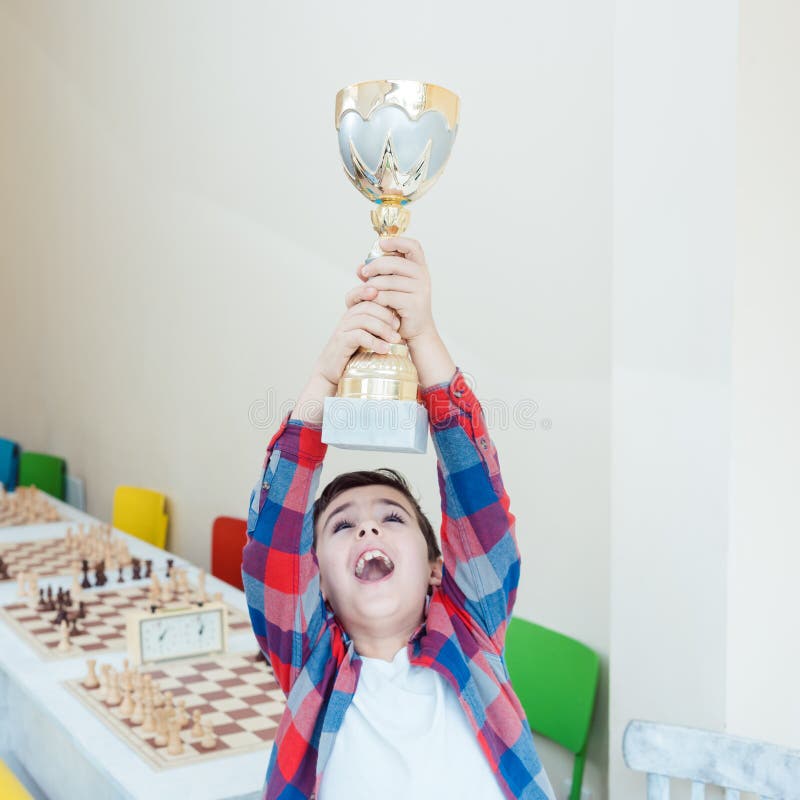 Boy Showing Trophy he Has Won in Chess Tournament Stock Photo - Image ...