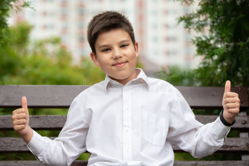 A Boy Shows a Class Sign Against a Background Stock Photo - Image of ...