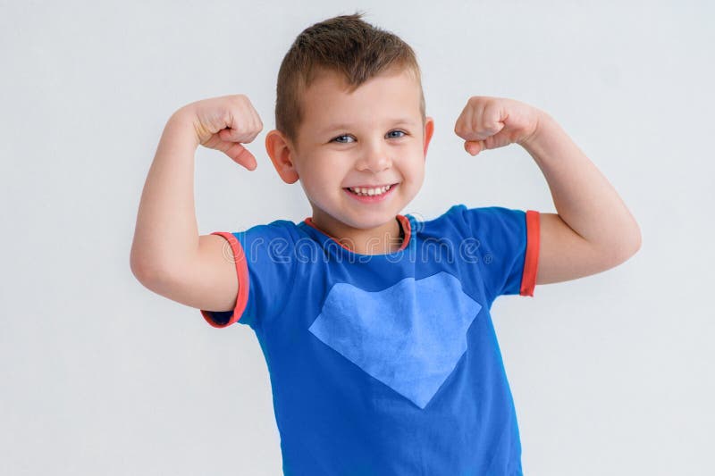A Boy Shows the Muscles in Her Arms Stock Image - Image of heroes ...