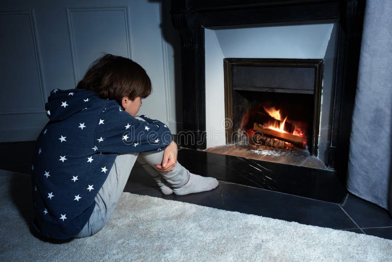 Boy Sit in Front of the Home Fireplace Look at Fire Stock Photo - Image ...